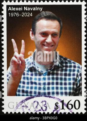 A portrait of Russian opposition leader Alexei Navalny, and candles are ...