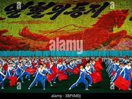 North Korean gymnasts with red flags during the Arirang mass games, DGC ...