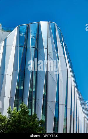 Modern Architectural Design Featuring Glass Facade and Angular Roofline ...