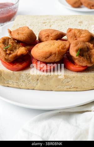 Nigerian deep fried Akara with bread and butter Stock Photo - Alamy