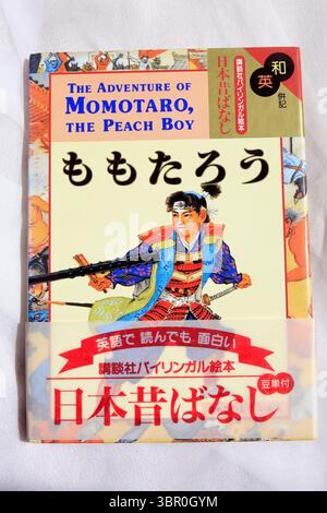 Photograph of The Adventures of Momotaro, The Peach Boy Japanese book. Studio set up. Used book ...