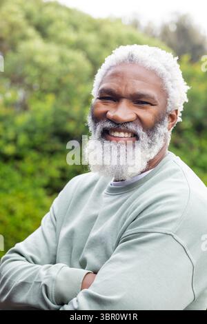 A senior man with a well-groomed beard and traditional jewelry Stock ...