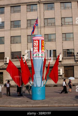 Set of North Korean flags in front of a building, DGC, Pyongyang, North ...