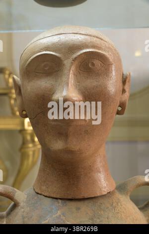 Etruscan canopic urn head, 7th century BCE, from Chiusi, Italy. On ...