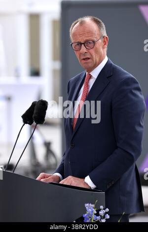 German Chancellor Friedrich Merz attends a news conference after a ...