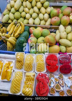 Fresh fruits in packing at market Stock Photo - Alamy
