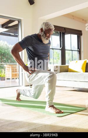 Fitness Enthusiast Performing Lunge Exercise With Dumbbells in a ...