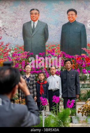 North Korean people posing in Kimilsungia and Kimjongilia festival, DGC ...