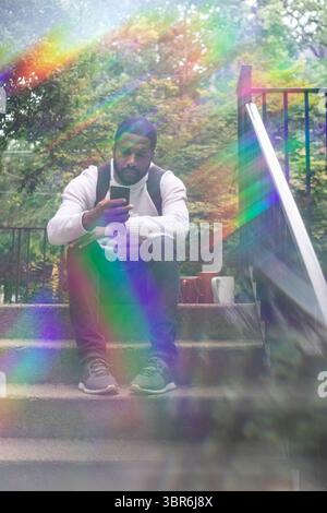 Colorful light leak on black background, abstract design with optical ...