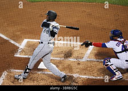 Chicago White Sox's Luis Robert looks out from the dugout during a ...