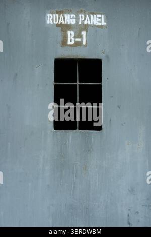 Minimalist industrial background featuring dark metal mesh wire panels ...