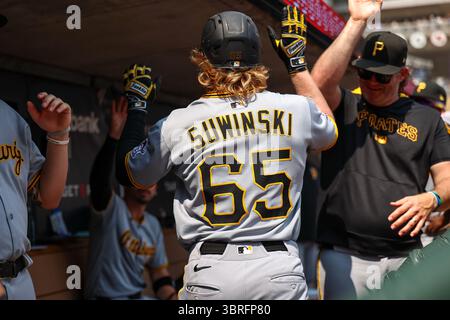 Pittsburgh Pirates' Jack Suwinski, left, and Oneil Cruz can't catch a ...