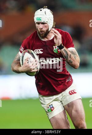 Mack Hansen of the British & Irish Lions passes the ball as he is ...