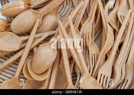 Non-plastic, biodegradeable, single-use spoons and forks set out for ...