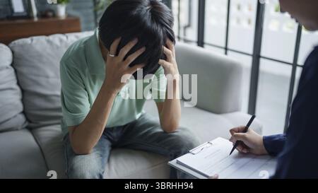 Professional psychotherapy Taking Note During Appointment Patient ...