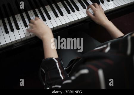 Beautiful asian girl learn to play piano Stock Photo - Alamy