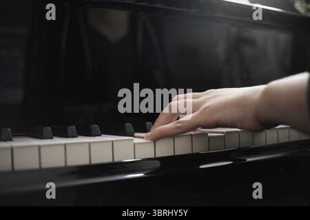 Beautiful asian girl learn to play piano Stock Photo - Alamy