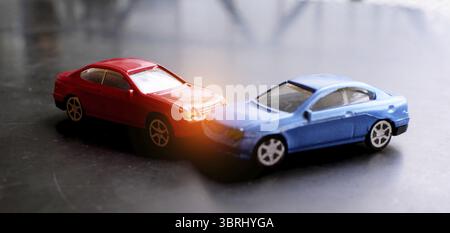 Toy cars crash accident. Simulation red and blue car Stock Photo - Alamy