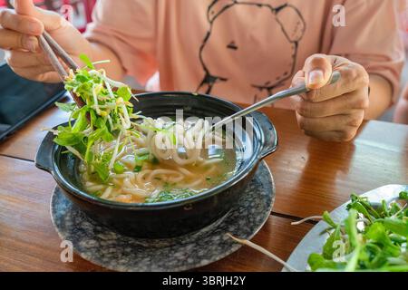 noodles flour made from fish meat topping ball and morning glory in ...