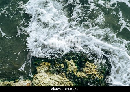 Textured tidal rocks beneath transparent seawater Stock Photo - Alamy