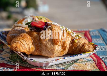Italian breakfast on Mondello beach, fresh baked butter croissant ...