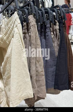 Denim Skirt Rack with Varying Washes and a Neutral Accent Stock Photo ...