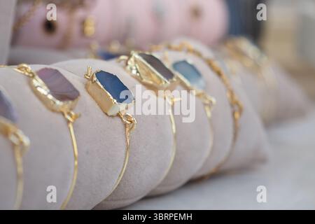 Gold bracelets and jewelry displayed at a market stall Stock Photo - Alamy