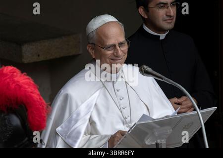 Pope Leo XIV delivers the Angelus prayer from the window of his studio ...