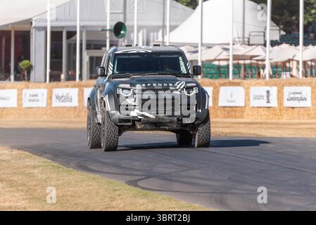Land Rover Defender Dakar D7X-R Prototype driving up the hill climb ...