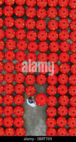 The workers are making the red lanterns for the coming new year in ...
