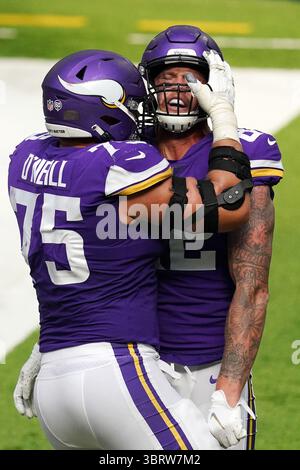 Minnesota Vikings offensive tackle Brian O'Neill (75) walks off the ...