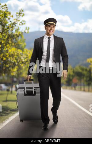 businessman in suit and pilot hat launch plane toy on sky background ...