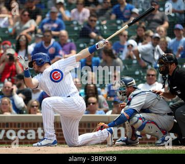 Chicago Cubs' Ian Happ strikes out swinging during the first inning of ...