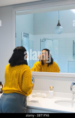 Woman adjusting facial patches Stock Photo - Alamy