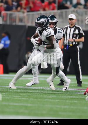 Philadelphia Eagles running back Miles Sanders, left, is tackled by San ...
