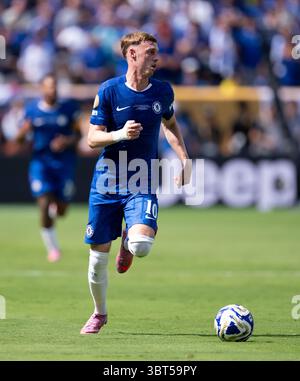 Cole Palmer of Chelsea plays the ball under pressure from Antonee ...