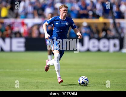 Cole Palmer of Chelsea plays the ball under pressure from Antonee ...