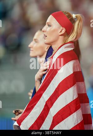 United States' Sandi Morris silver medalist, left, hugs her husband ...