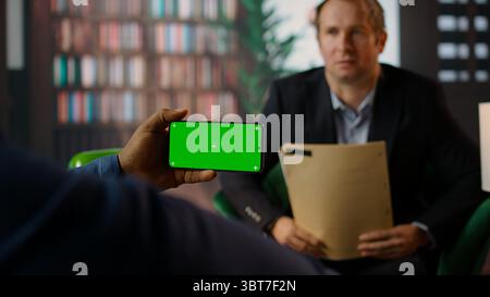Professional espionage team share mission insight next to mockup over ...