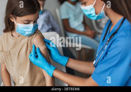 Preteen Girl Getting Vaccinated Against Covid-19 With Vaccine In Clinic ...