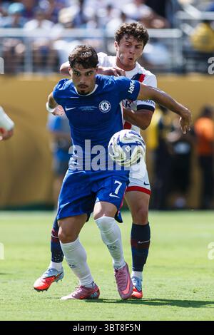 Chelsea player JOao Pedro and PSG player Beraldo in action during the ...