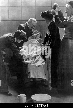 A Suffragette being force-fed in prison Stock Photo - Alamy