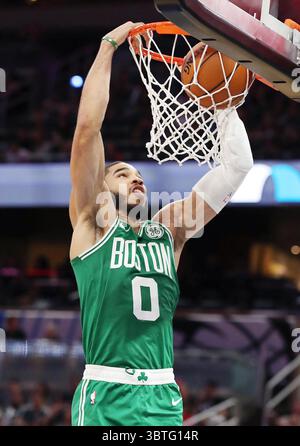 Jayson Tatum of the Boston Celtics dunks during the first half of the ...
