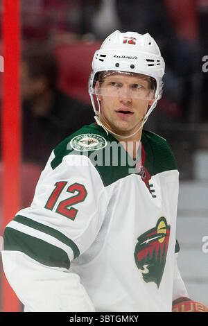 Minnesota Wild center Eric Staal controls the puck against the Calgary ...