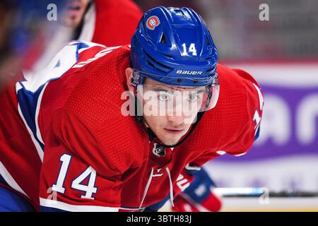 Montreal Canadiens' Nick Suzuki (14) congratulates Carolina Hurricanes ...