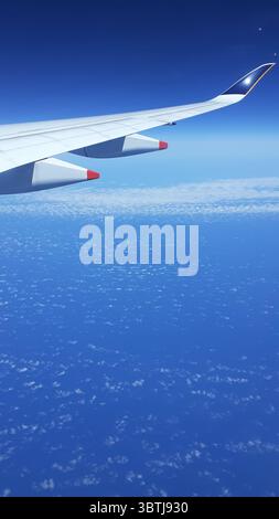 View from the window seat of commercial passenger airplane Stock Photo ...