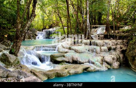 Limestone waterfall in tropical forest, west of Thailand Stock Photo ...