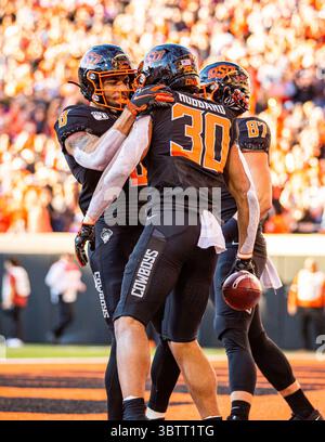 Oklahoma State wide receiver Christian Fitzpatrick (16) catches a pass ...