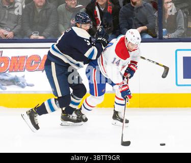 Montreal Canadiens center Nick Suzuki (14) plays against the Detroit ...