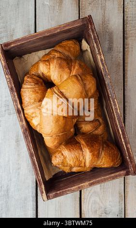 Baked golden brown French croissants Stock Photo - Alamy